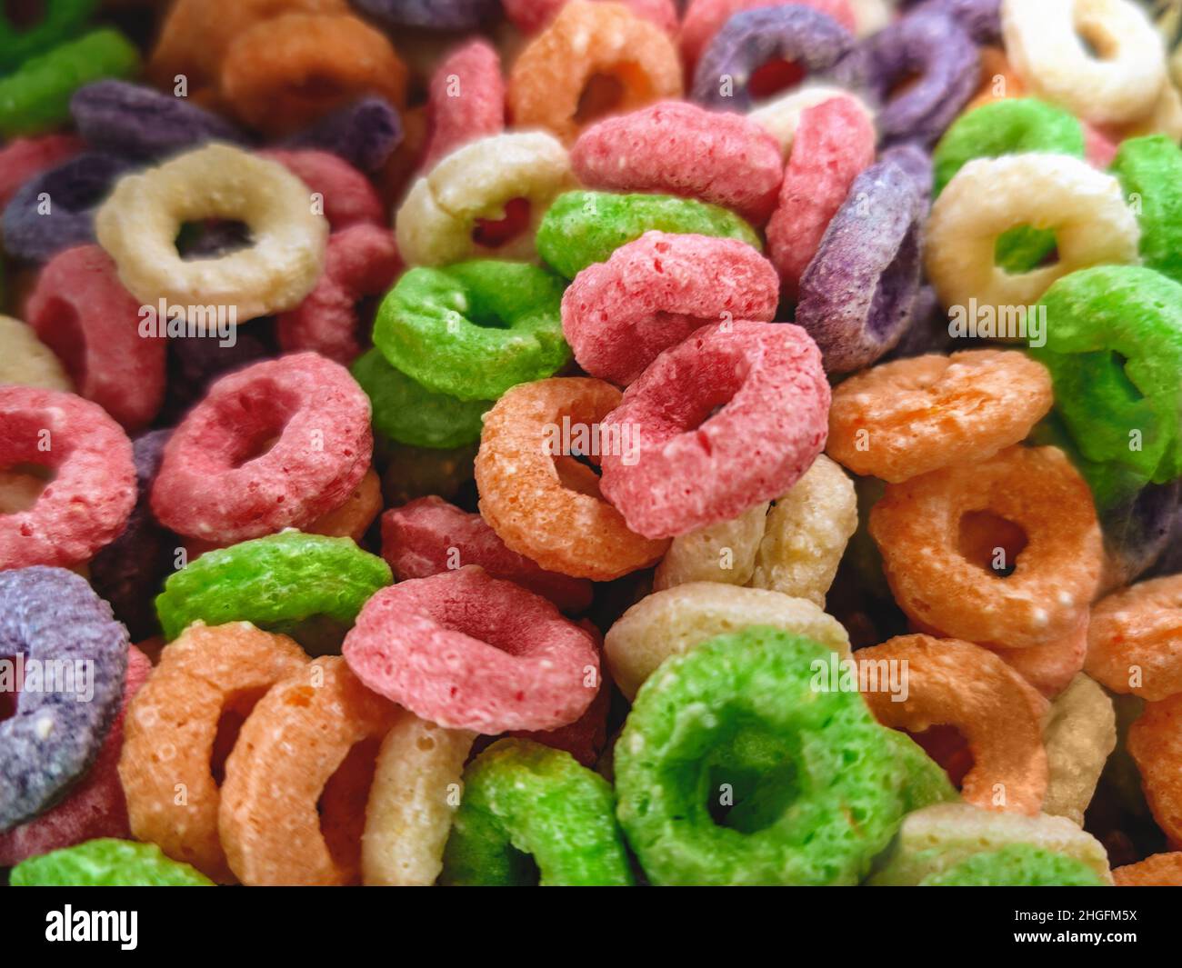 Colorful fruit sugary corn cereal rings. Highly detailed macro close up ...
