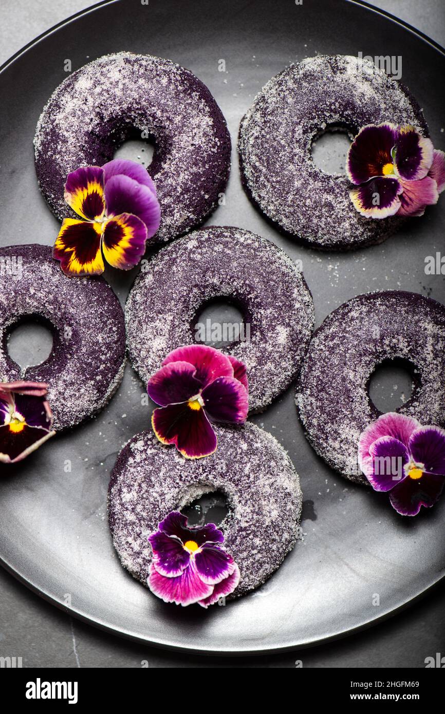 Sweet ube also known as purple yam dessert doughnut with flowers Stock ...