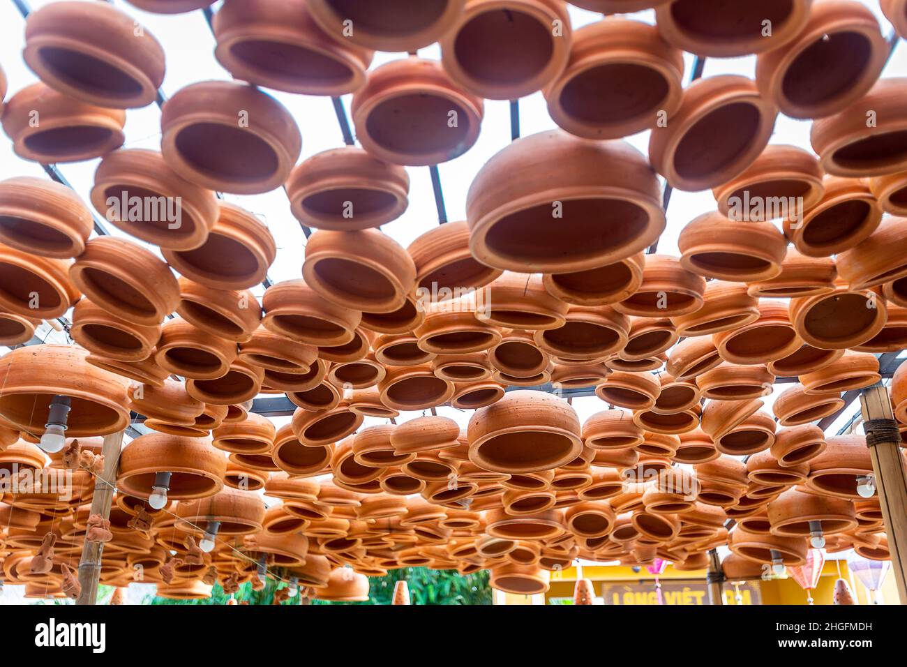 Walking area outdoors with hanging clay pots used across the top Stock ...