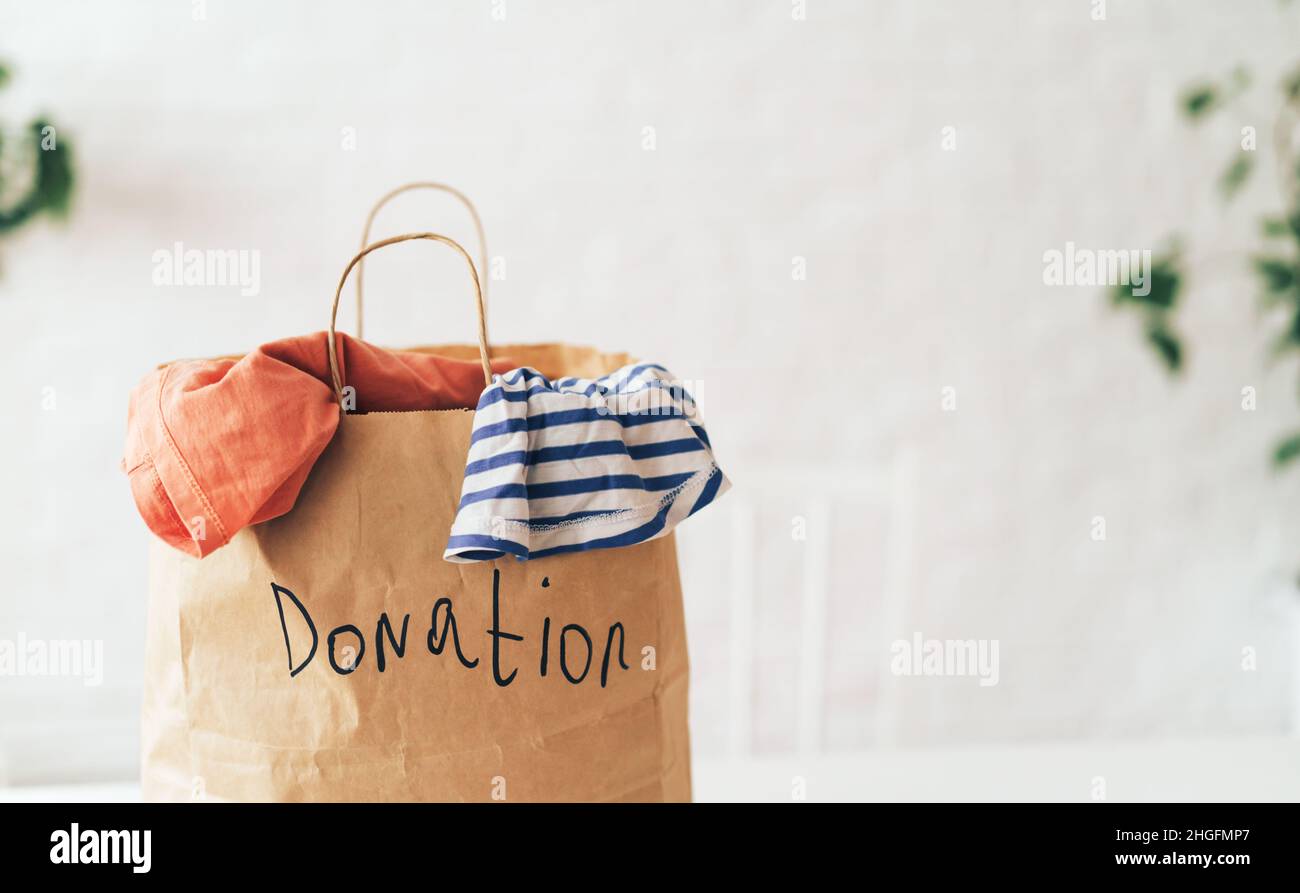 Woman charity clothes bag hi-res stock photography and images - Alamy