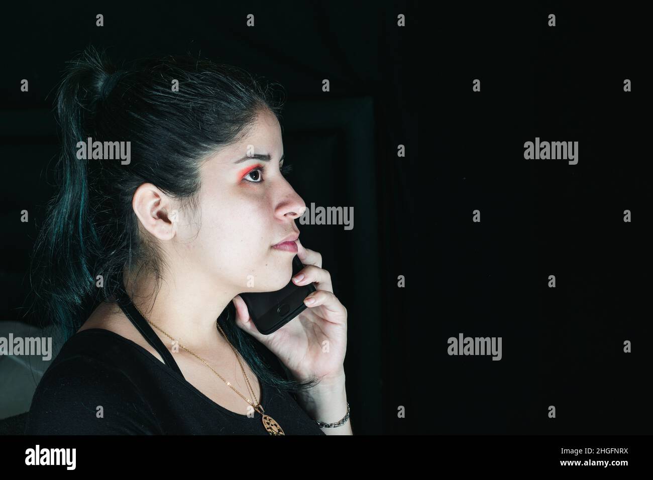 Beautiful Latina Woman With Green Hair Receiving A Call On Her Cell