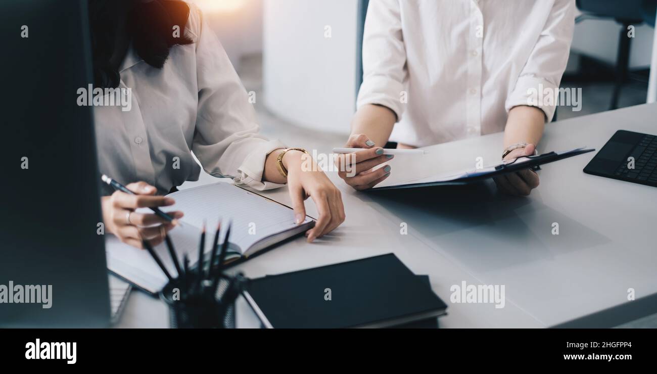 Business woman or accountant making working audit with her team ...