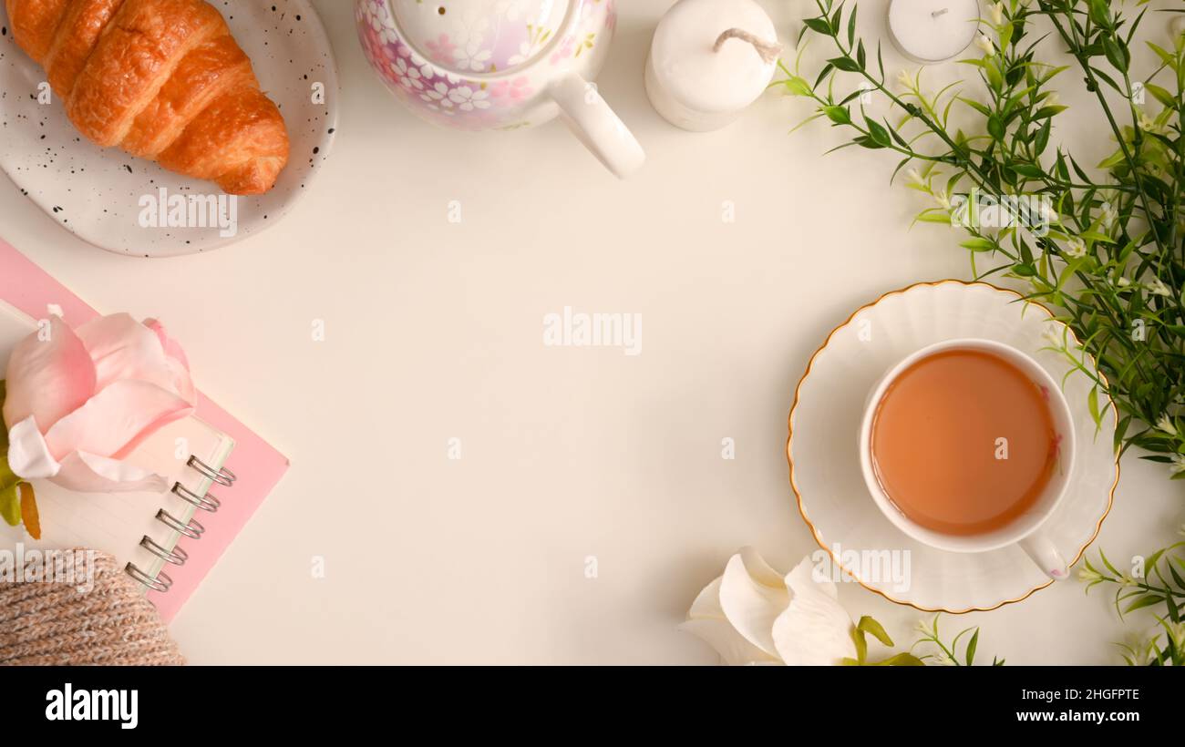 Beautiful English afternoon tea set with bakery, flowers and copy space ...