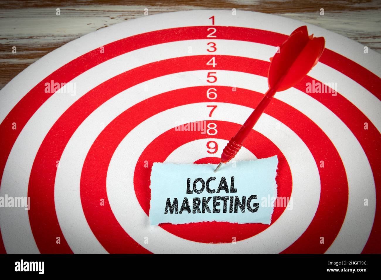 Local Marketing. Red target and dart in center Stock Photo - Alamy