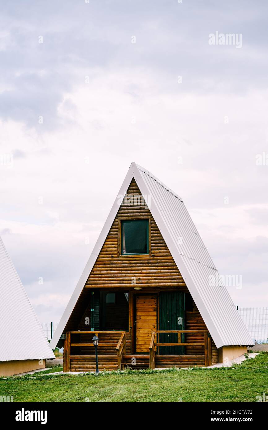 Triangular wooden two-storey house in the north of Montenegro Stock ...