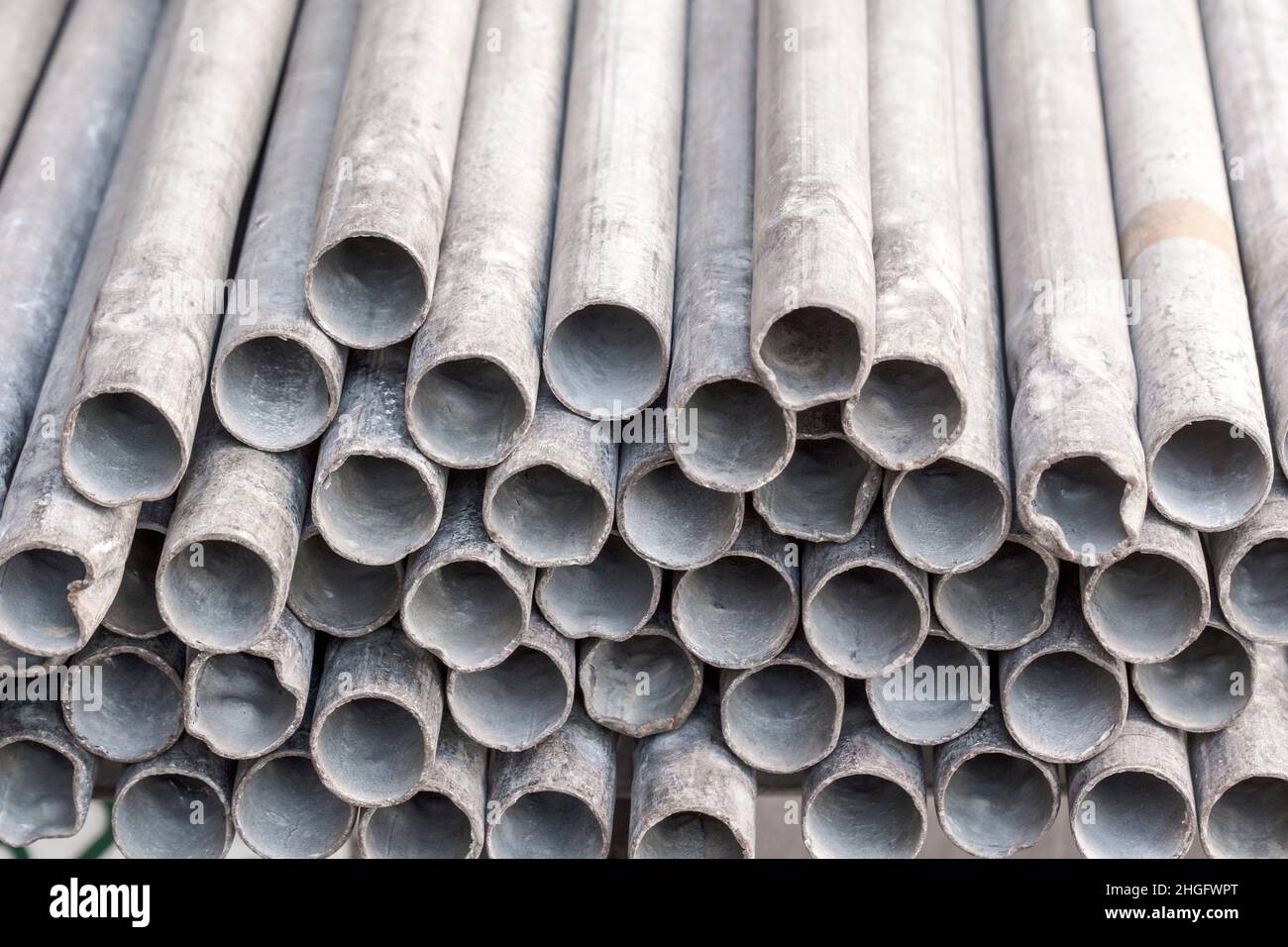 Old steel pipes in warehouse Stock Photo - Alamy