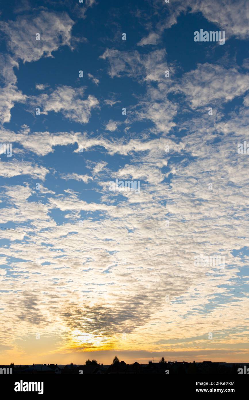 A deep sunset blue sky with clouds. Front view. Russia Stock Photo - Alamy