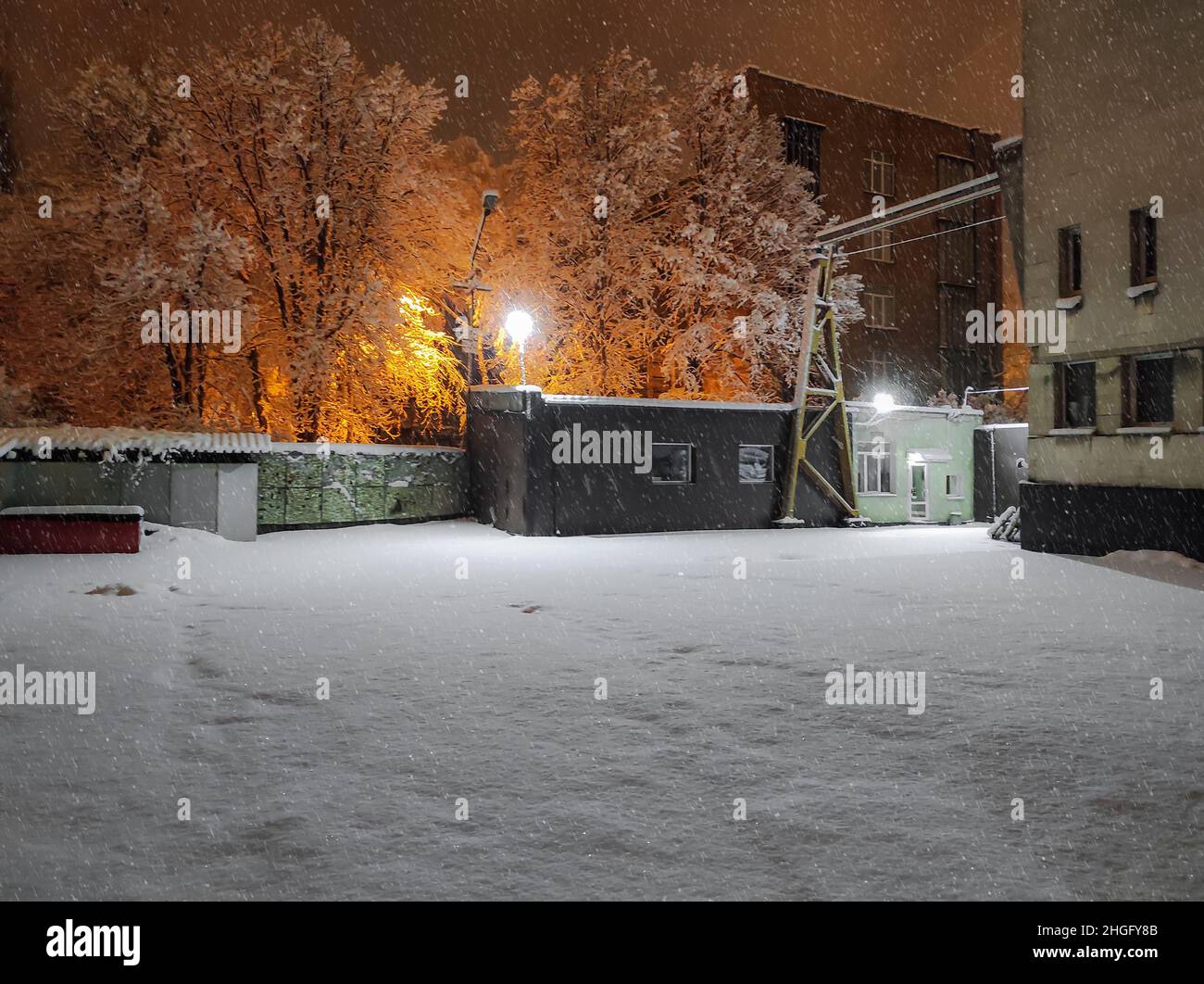View of an empty courtyard in small industrial area during a night ...