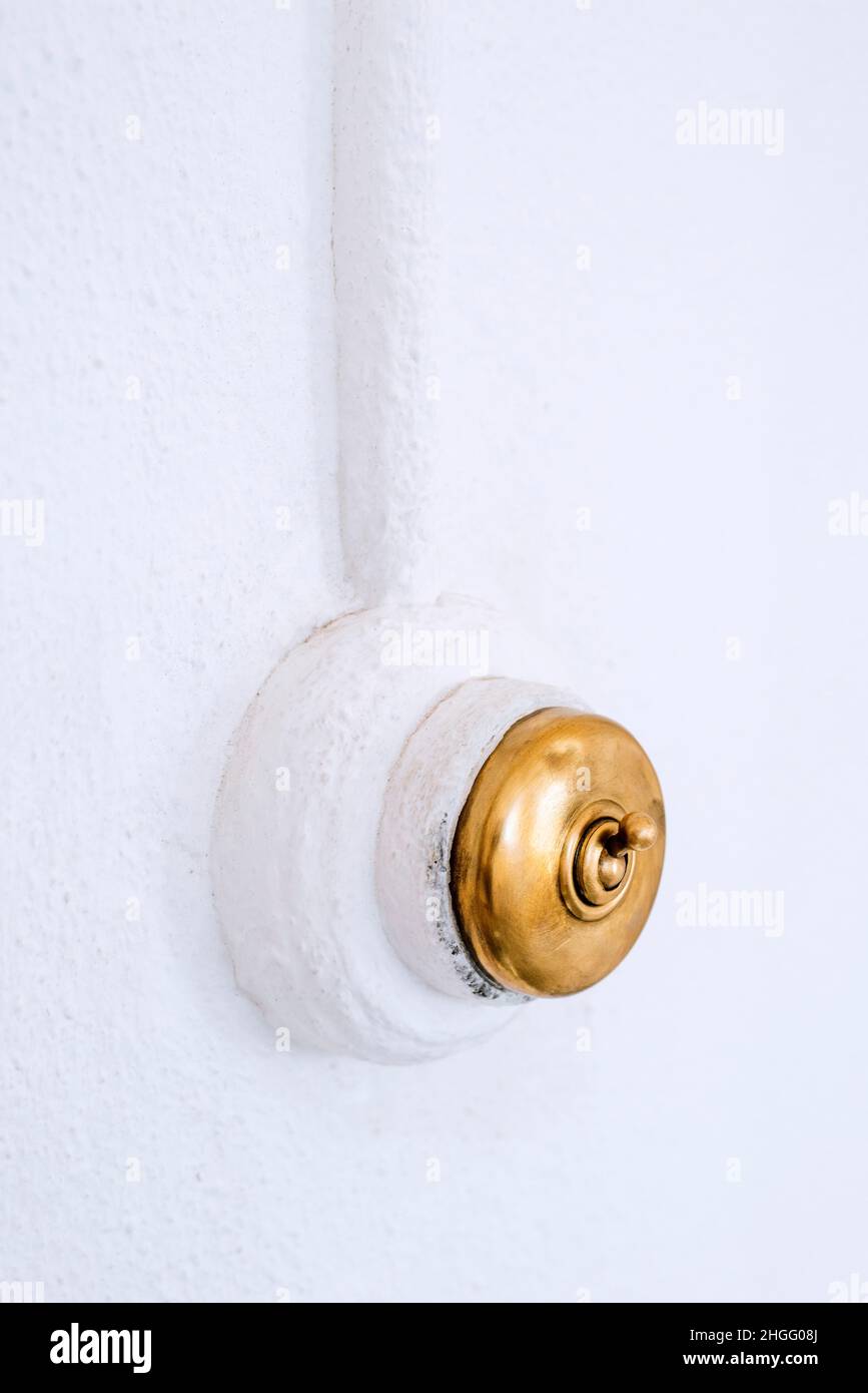 old simple light switch on white wall Stock Photo - Alamy