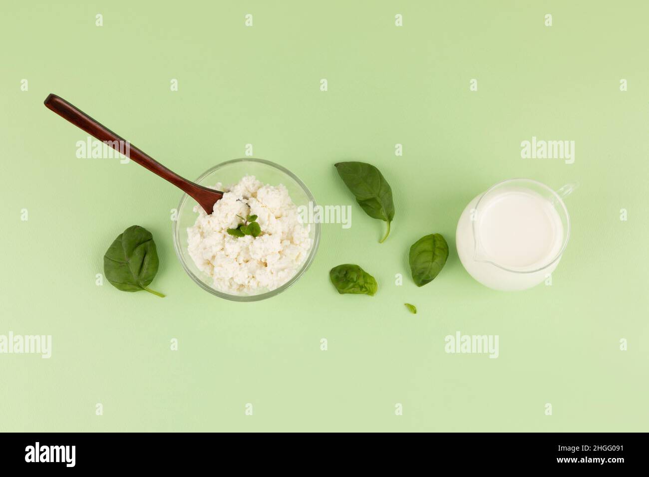 yogurt and milk, green background Stock Photo - Alamy