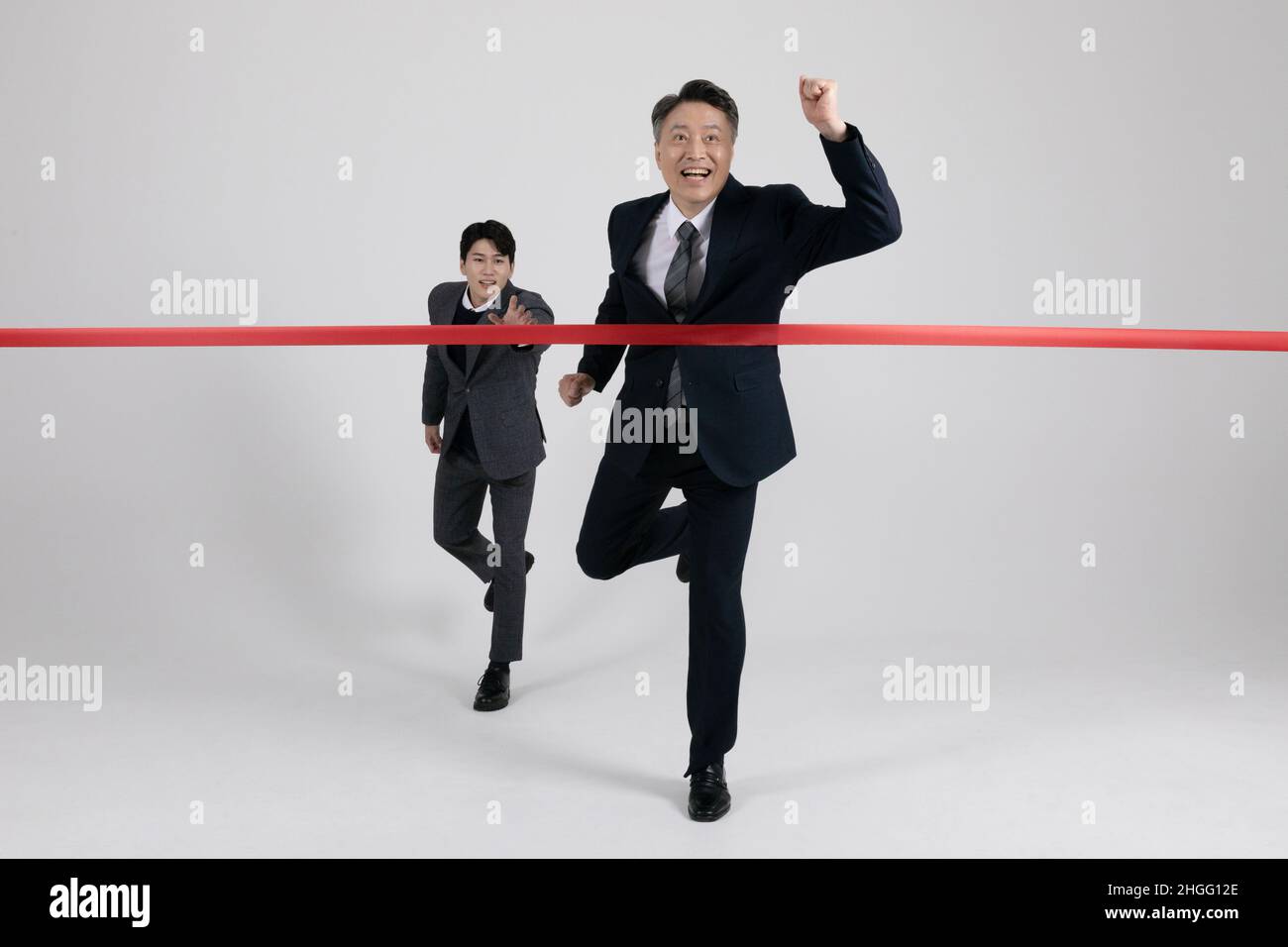 business concept Korean Asian old and young men going to the finish ...