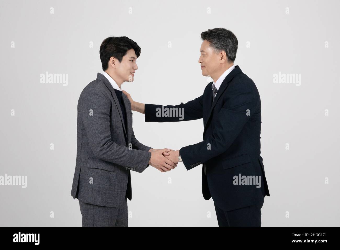 business concept Korean Asian old and young men requesting action Stock ...