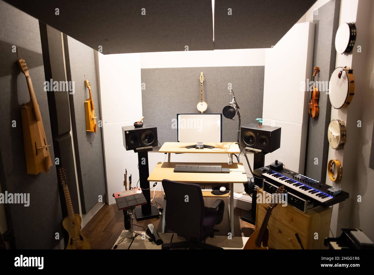 Music studio full of instruments and pc display Stock Photo - Alamy
