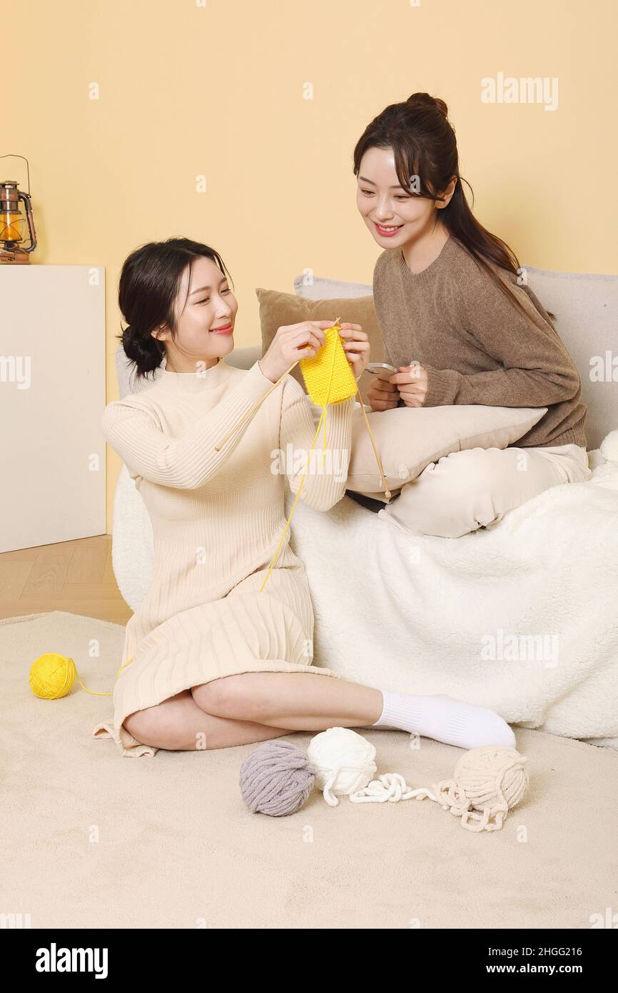 asian korean women best friends enjoying knitting hobby Stock Photo - Alamy