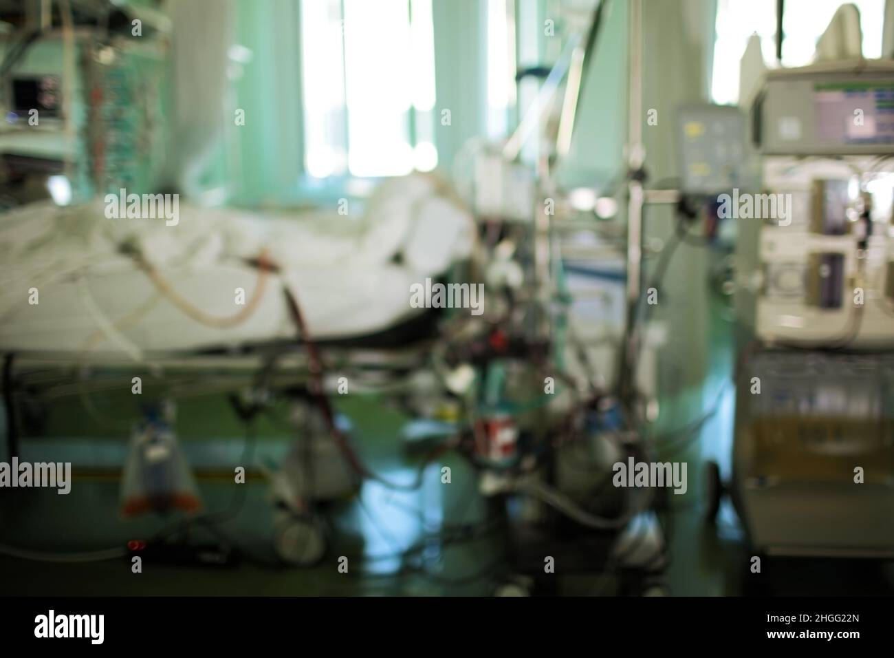 High tech equipped room with patient in bed in the ICU, unfocused ...