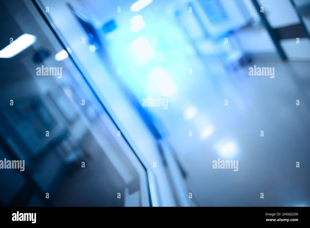 Blurred laboratory aisle with supervision windows and illuminated ...