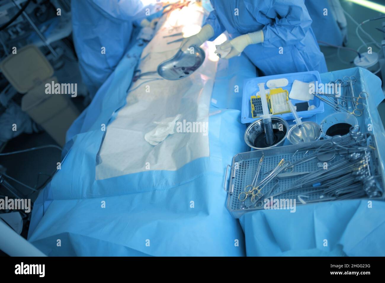 Working surgeons during process of emergency surgery in the ICU ...