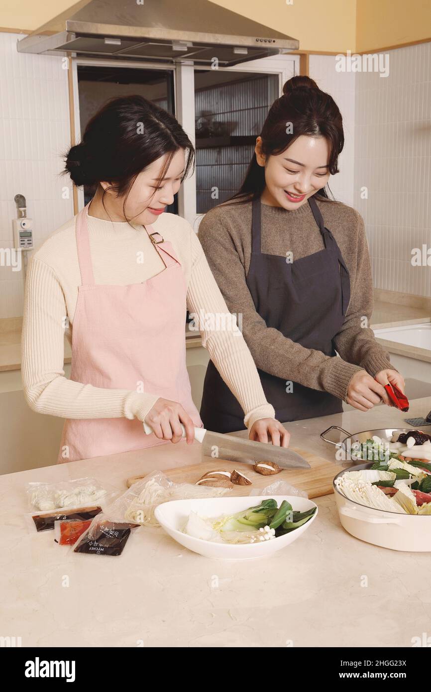 beautiful asian korean women cooking home meal kit Stock Photo - Alamy