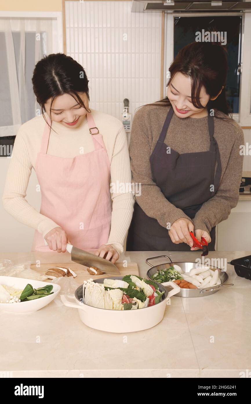 beautiful asian korean women cooking home meal kit Stock Photo - Alamy