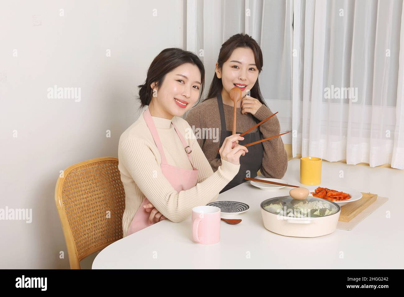 beautiful asian korean women cooking home meal kit Stock Photo - Alamy