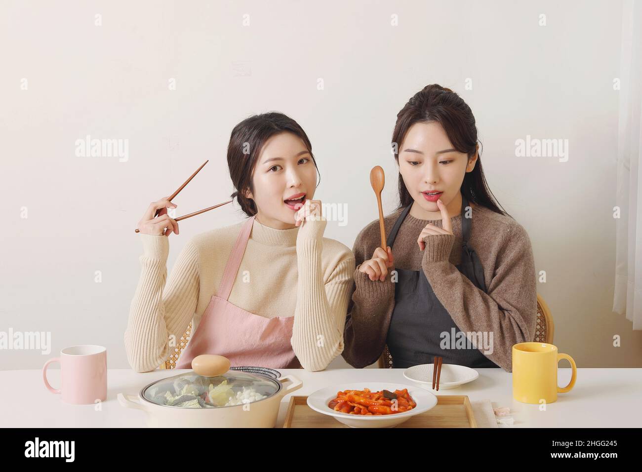beautiful asian korean women cooking home meal kit Stock Photo - Alamy