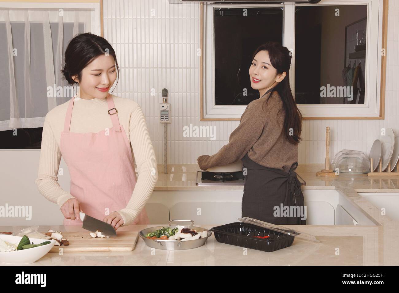 beautiful asian korean women cooking home meal kit Stock Photo - Alamy