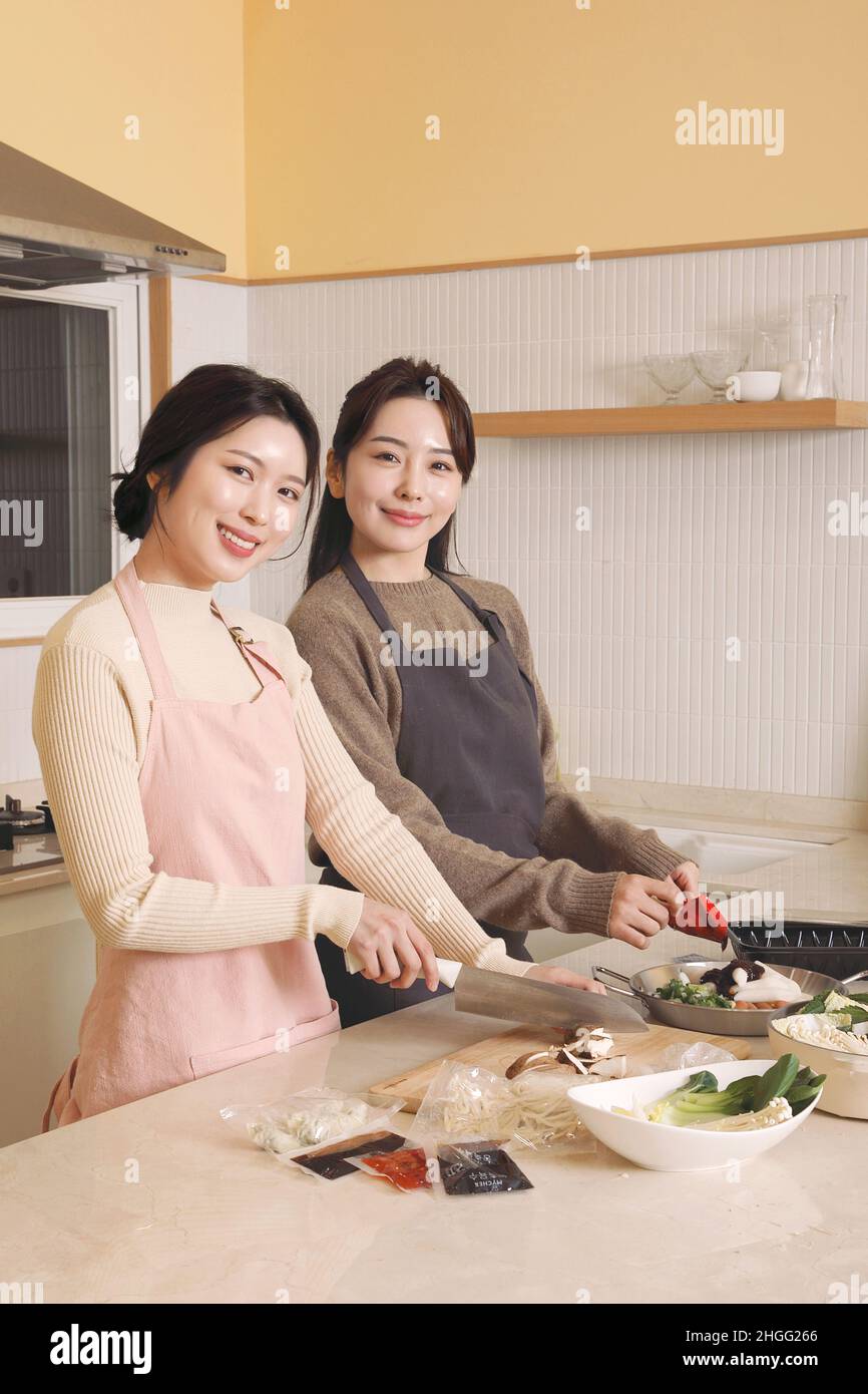 beautiful asian korean women cooking home meal kit Stock Photo - Alamy