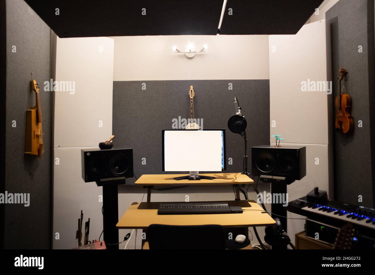Music studio full of instruments and pc display Stock Photo - Alamy