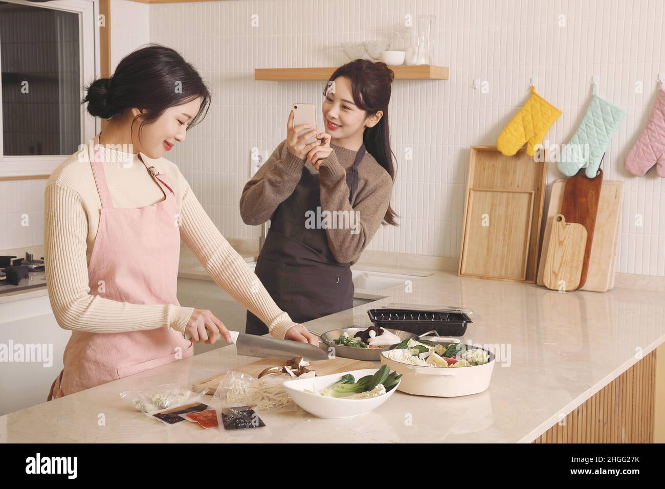 beautiful asian korean women cooking home meal kit Stock Photo - Alamy