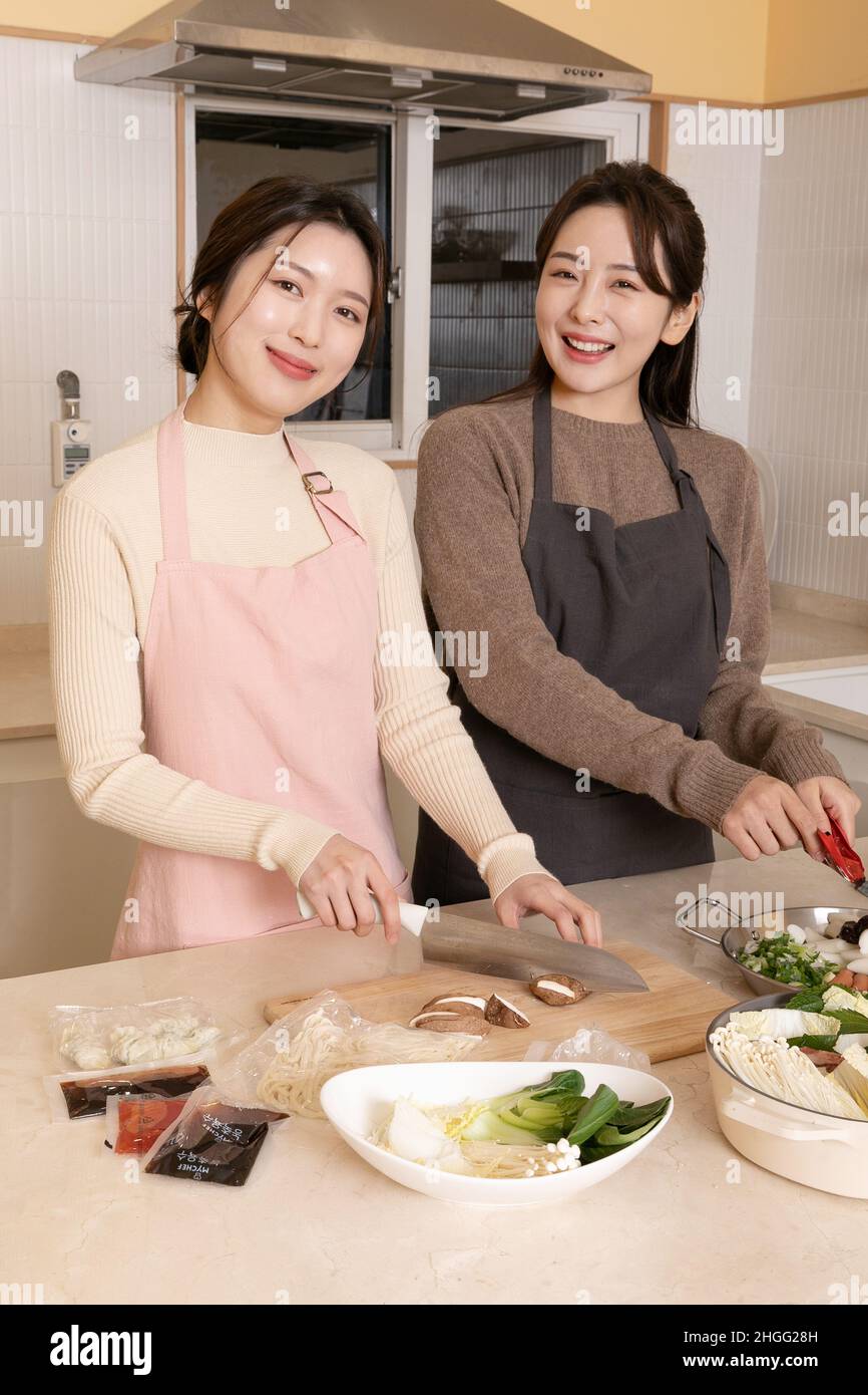 beautiful asian korean women cooking home meal kit Stock Photo - Alamy