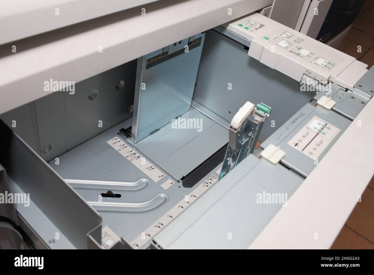 Paper source tray of the color printer Stock Photo - Alamy