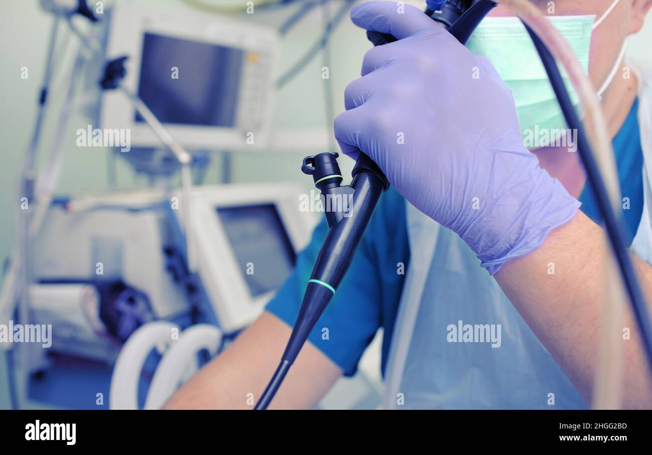 Working doctor during medical procedure Stock Photo - Alamy