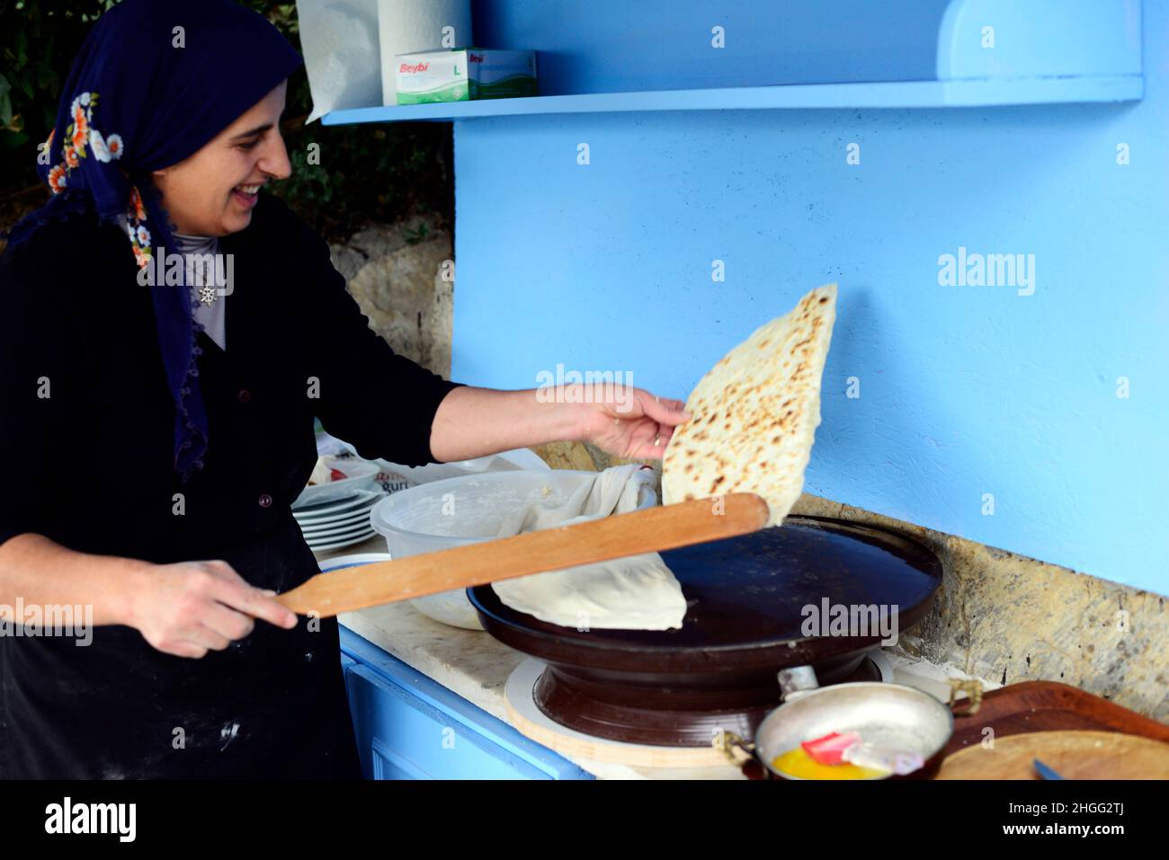 A Turkish woman preparing traditional flat bread Stock Photo - Alamy
