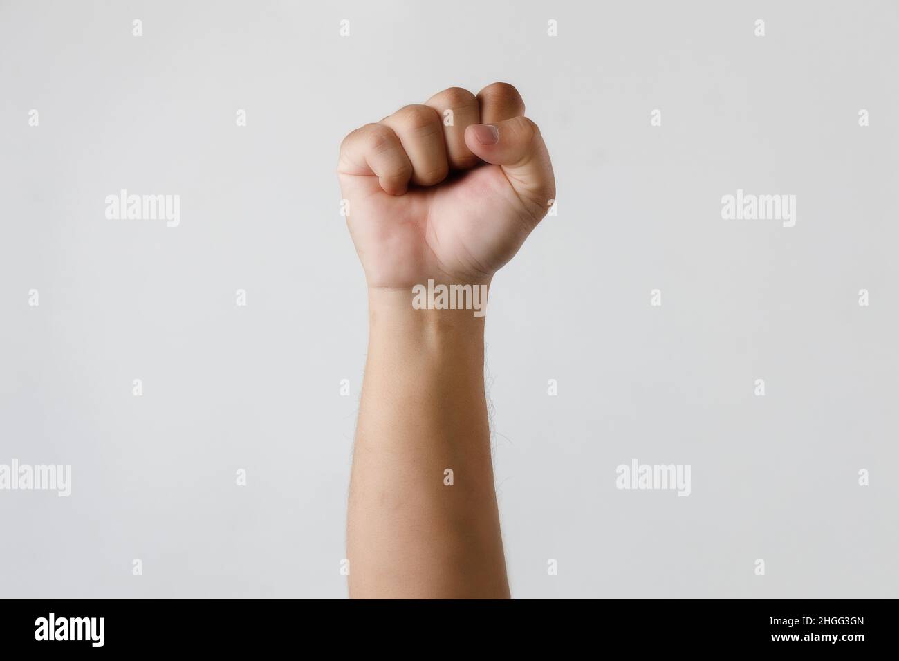 Man fist up isolated on white background success or strength Stock ...