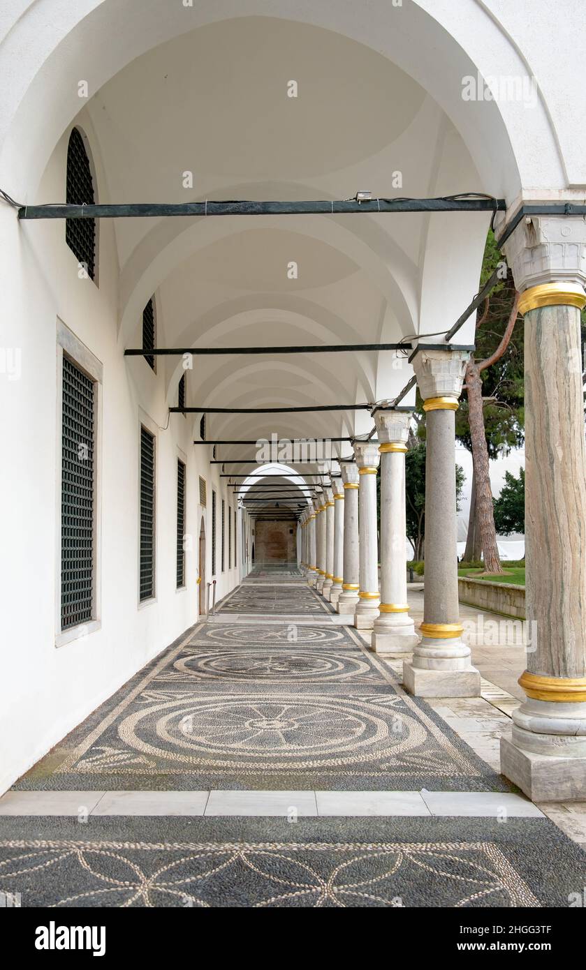 Outside, historic white rows of arches and columns. Historical white ...