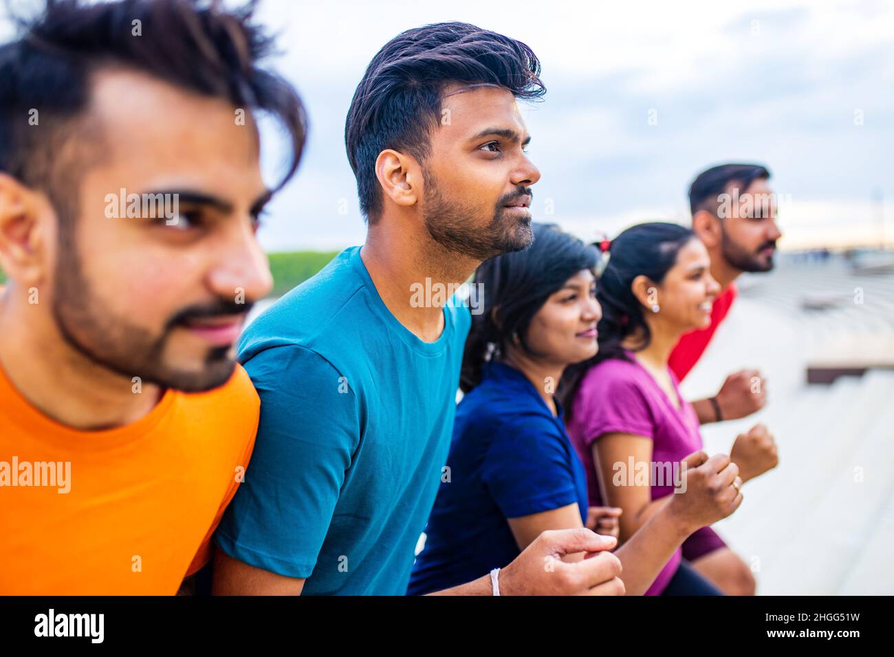 Large group of multi generation people running a race competition Stock ...