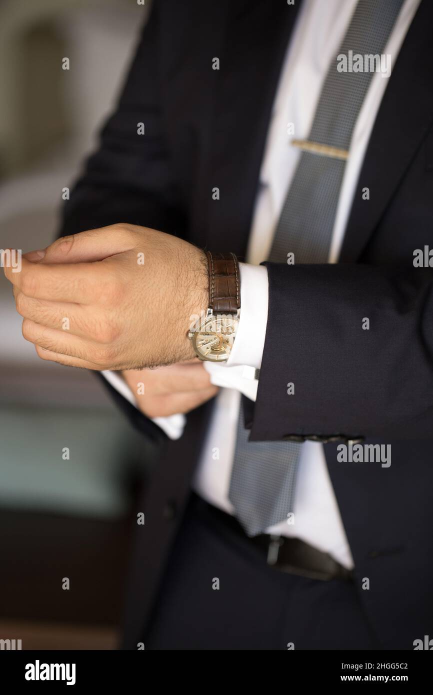 Man in a suit puts a watch High Resolution Stock Photography and Images ...