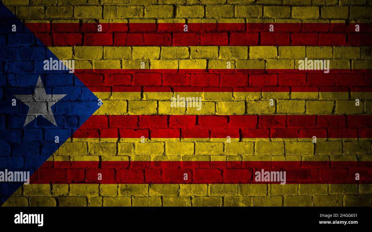The Flag of Catalonia on brick wall in grunge aesthetic. Civil and ...