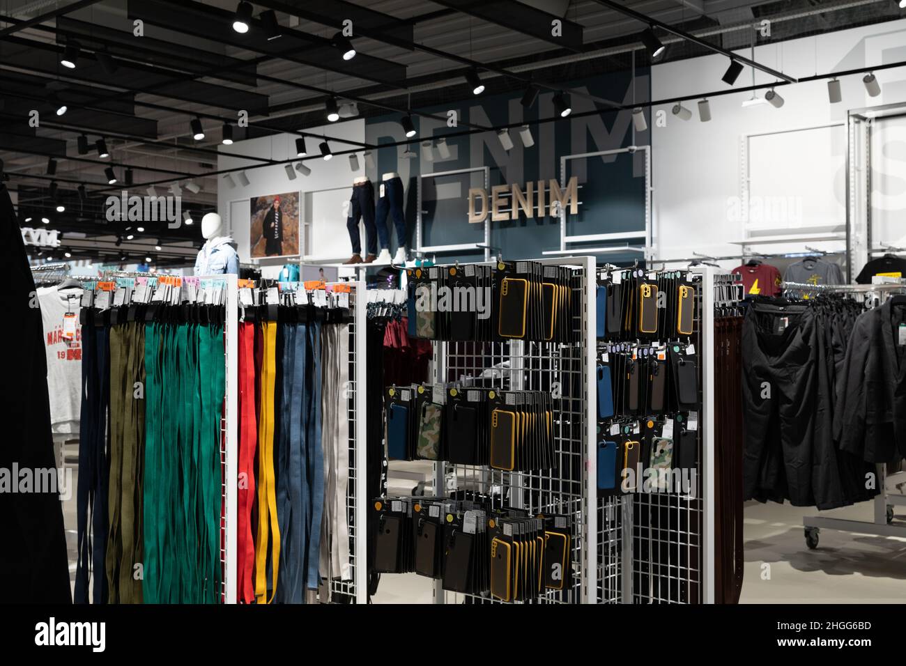 interior of a large store selling clothes and accessories in a mall ...
