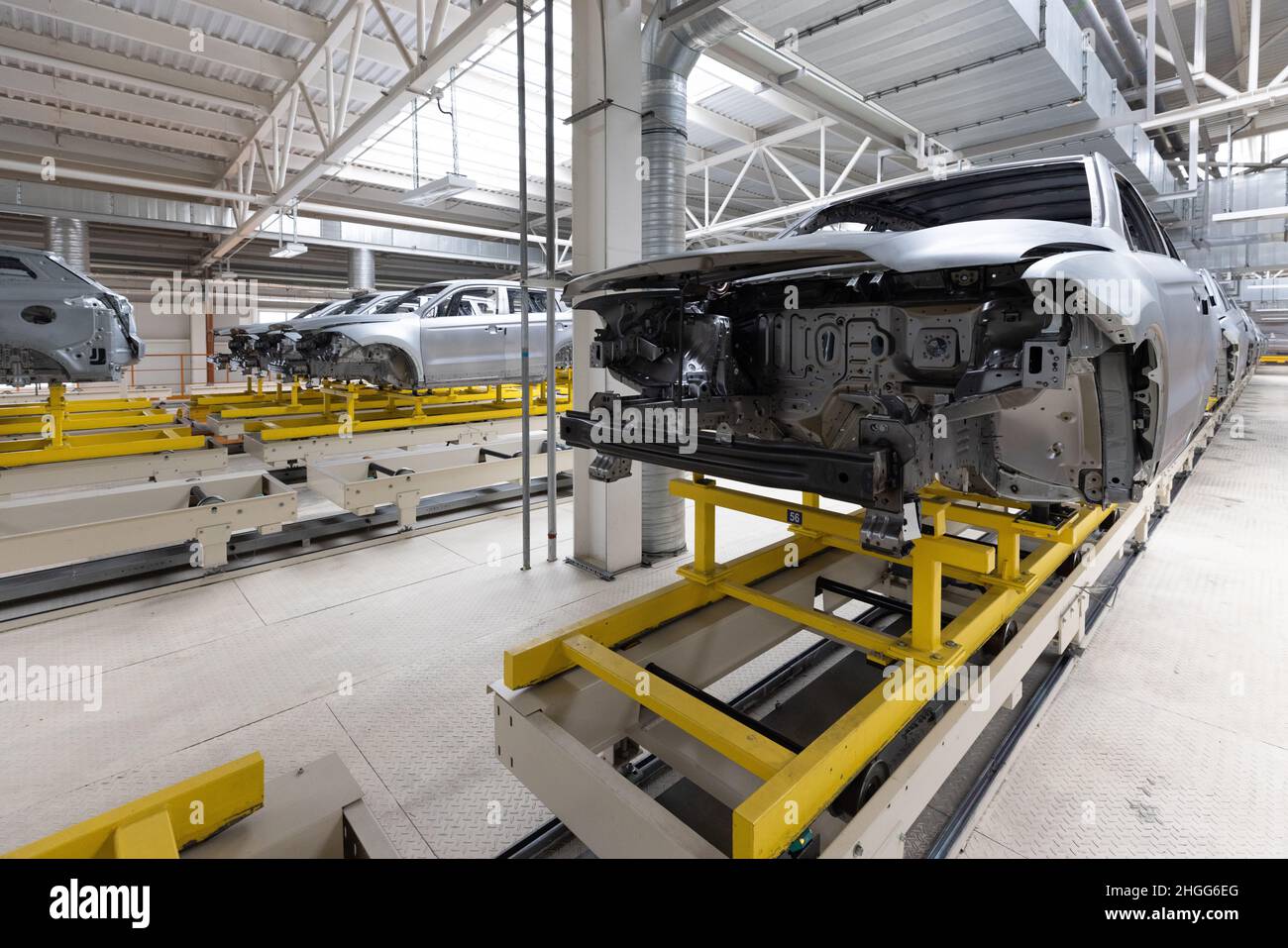 Car bodies are on assembly line. Factory for production of cars. Modern ...