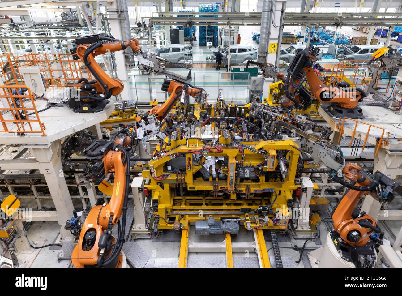 Car bodies are on assembly line. Factory for production of cars. Modern ...