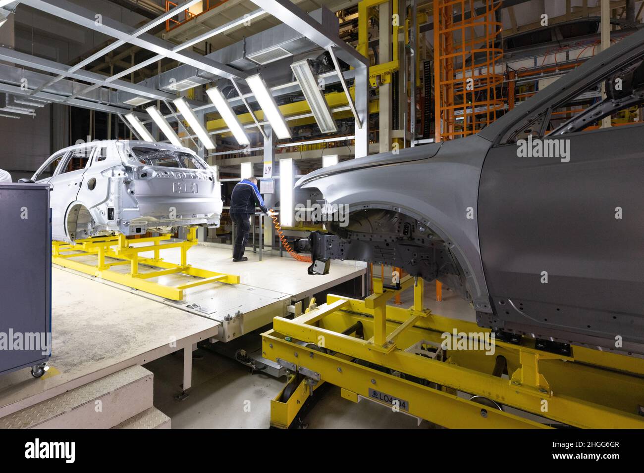 Car bodies are on assembly line. Factory for production of cars. Modern ...