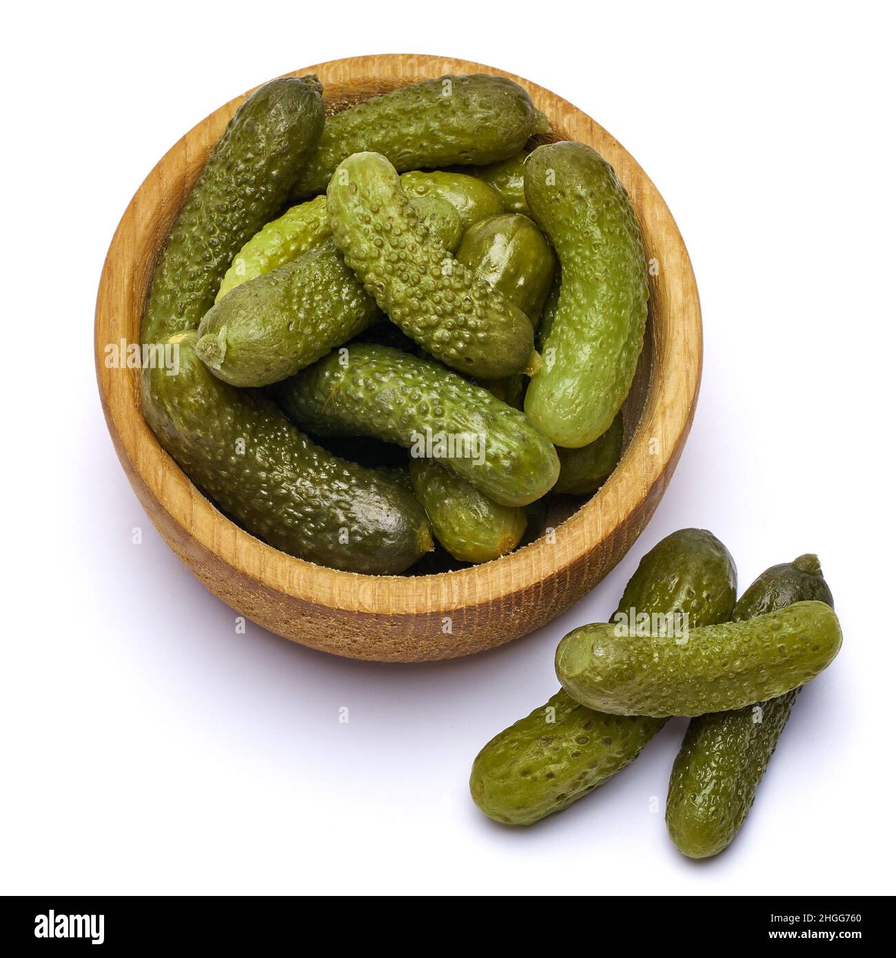 Bowl of Tasty canned Whole green cornichons isolated on a white ...