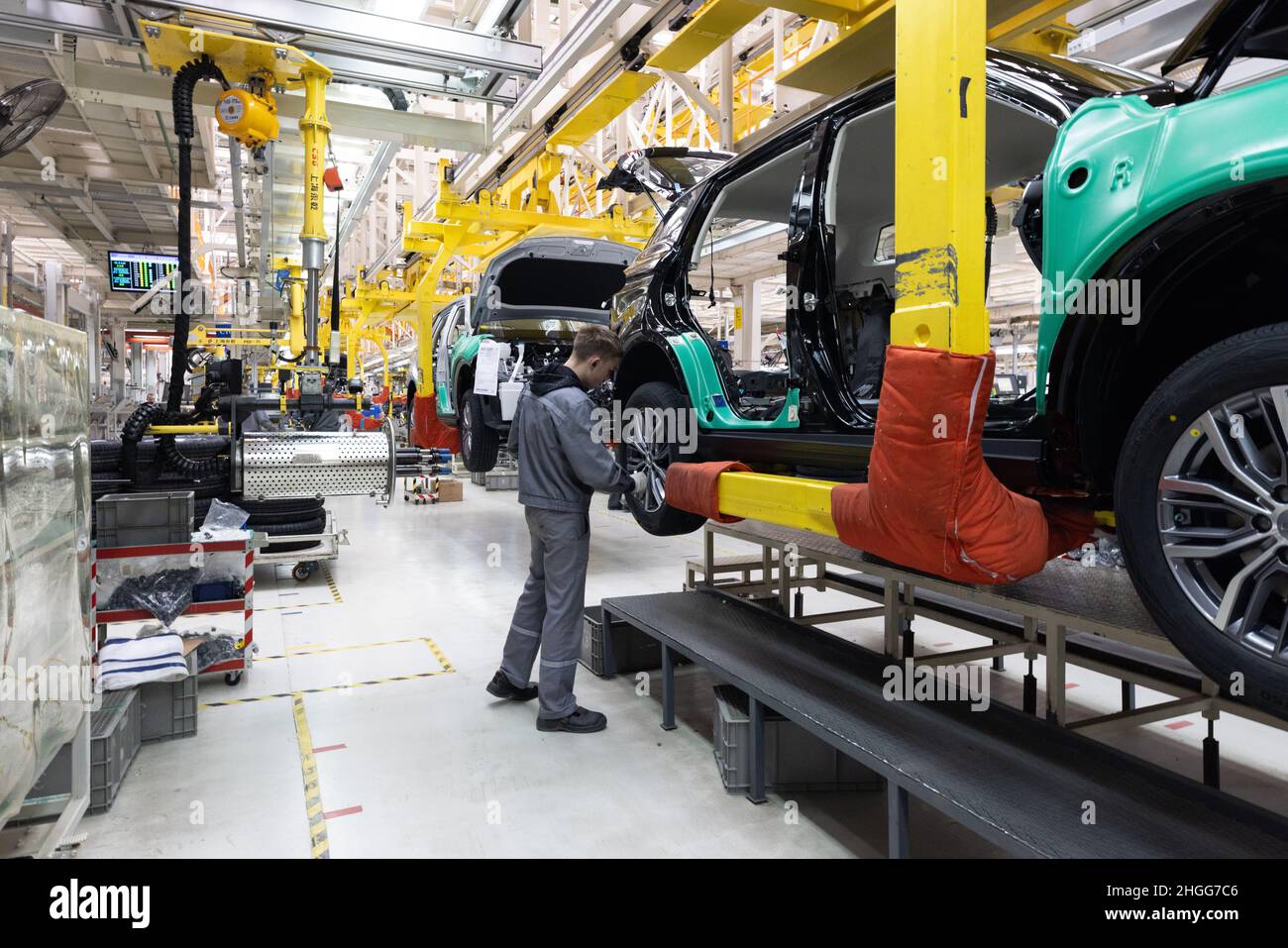 Car bodies are on assembly line. Factory for production of cars. Modern ...