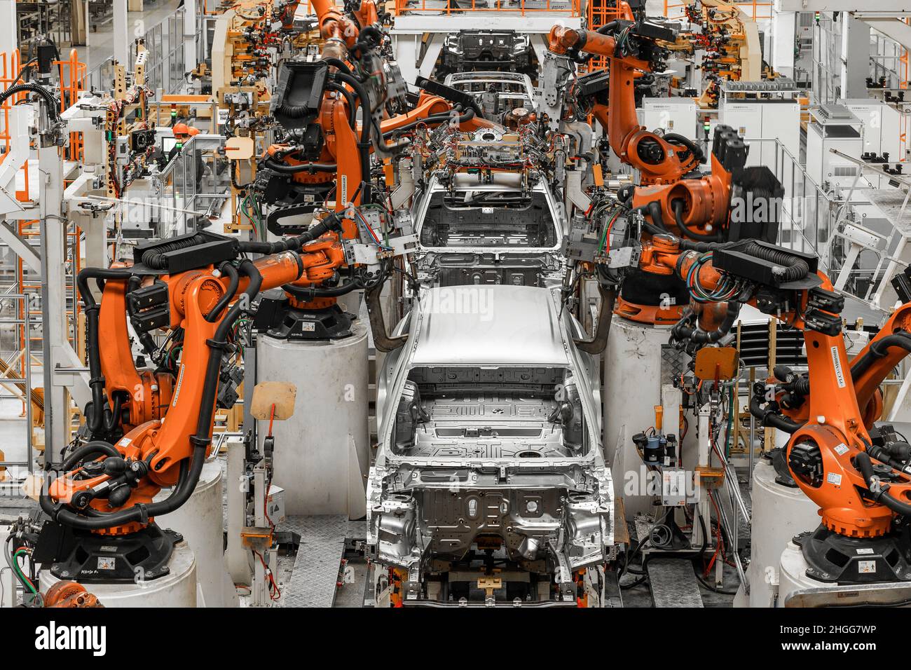 Photo of automobile production line. Modern car assembly plant. Modern ...