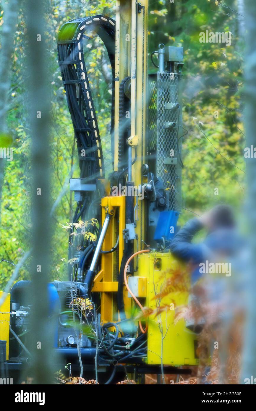 Self-propelled Mini-drilling rig drills the soil in forest conditions ...