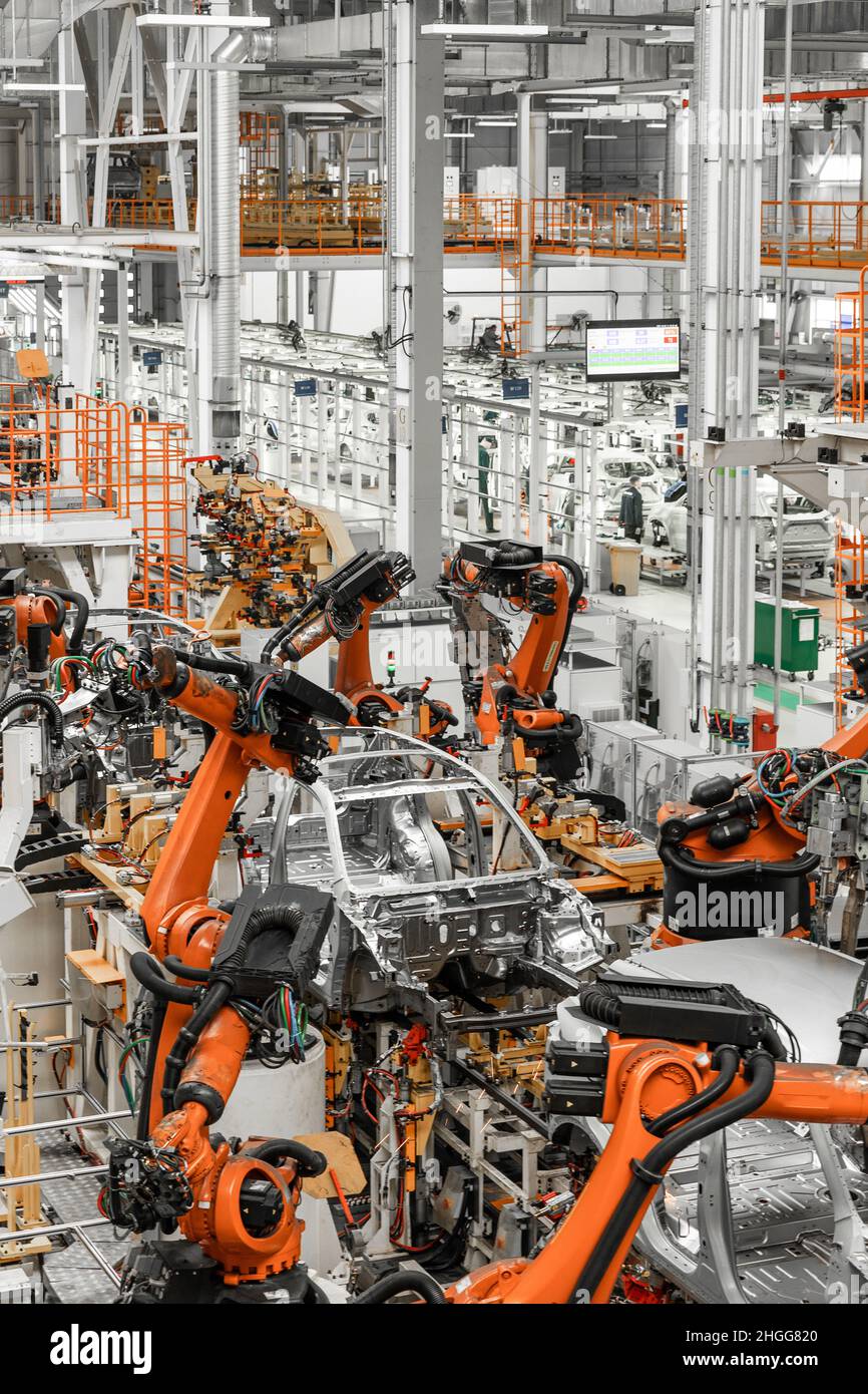 Vertical photo of automobile production line. Modern car assembly plant ...