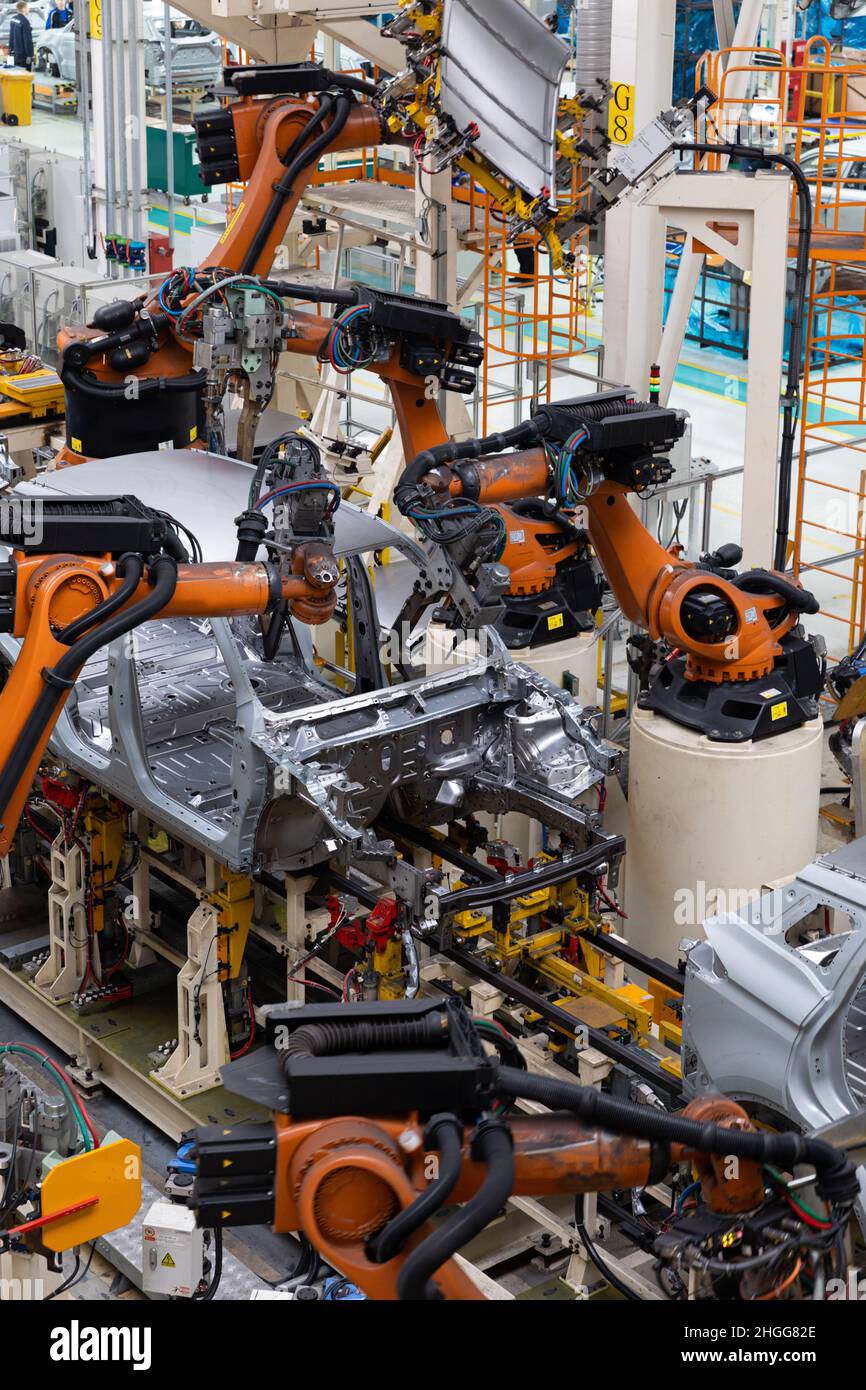 Vertical photo of automobile production line. Modern car assembly plant ...