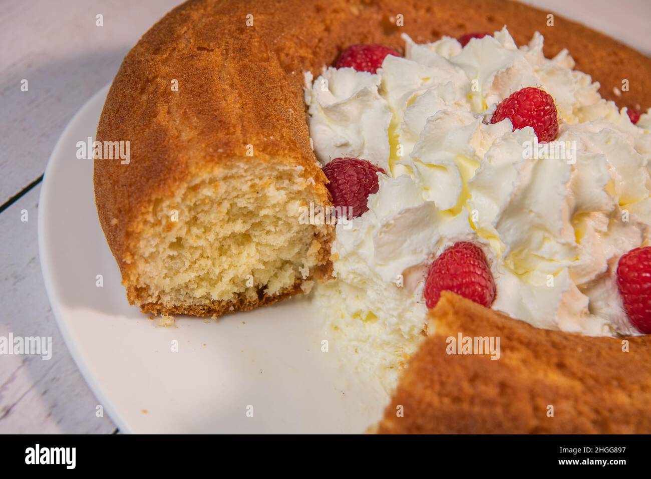 Pastry, Traditional Italian rum cake with whipped cream and raspberries ...