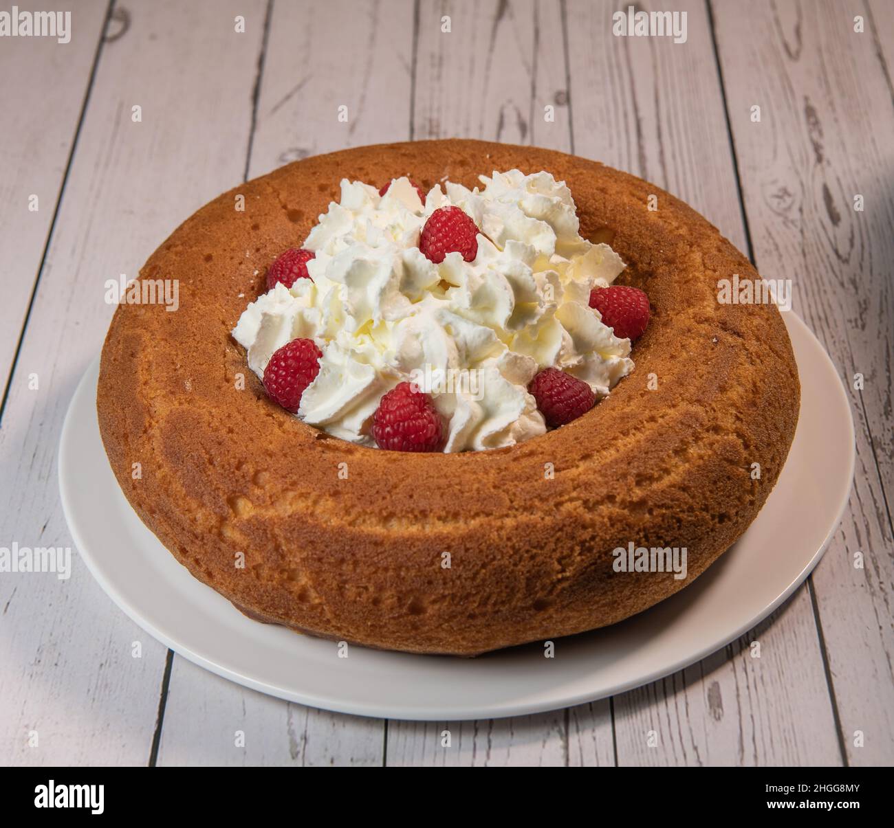 Pastry, Traditional Italian rum cake with whipped cream and raspberries ...